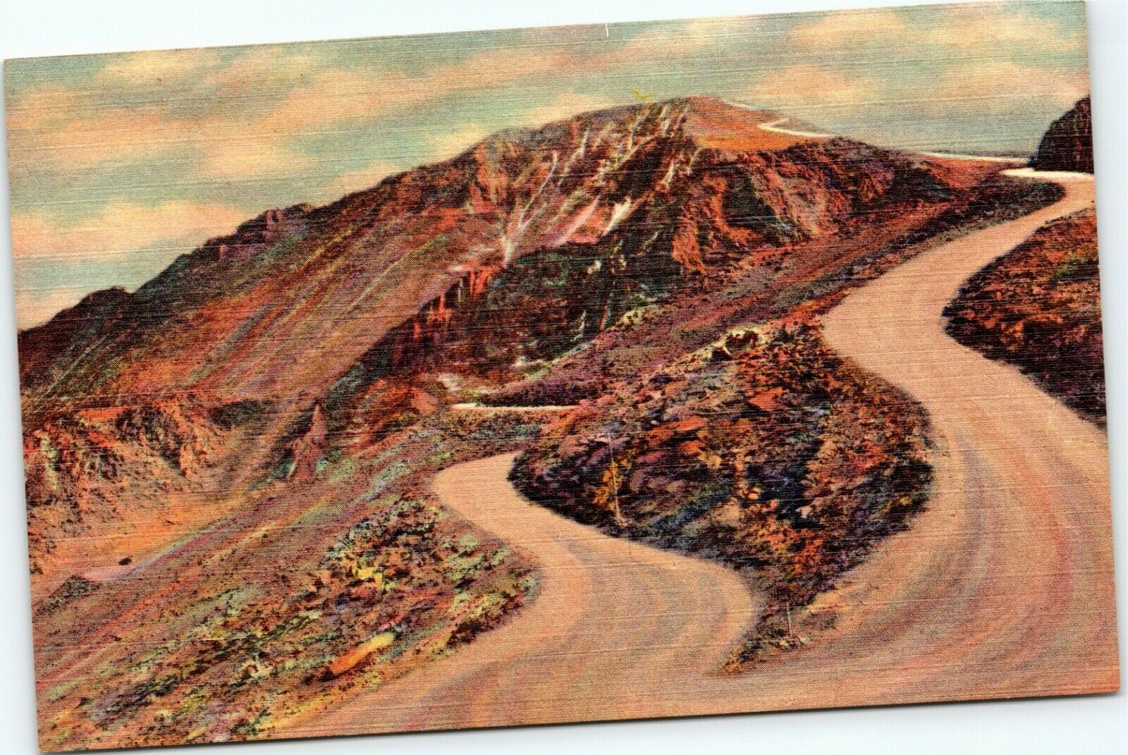 Nearing top of Pike's Peak on highway with partial view of switchbacks ...