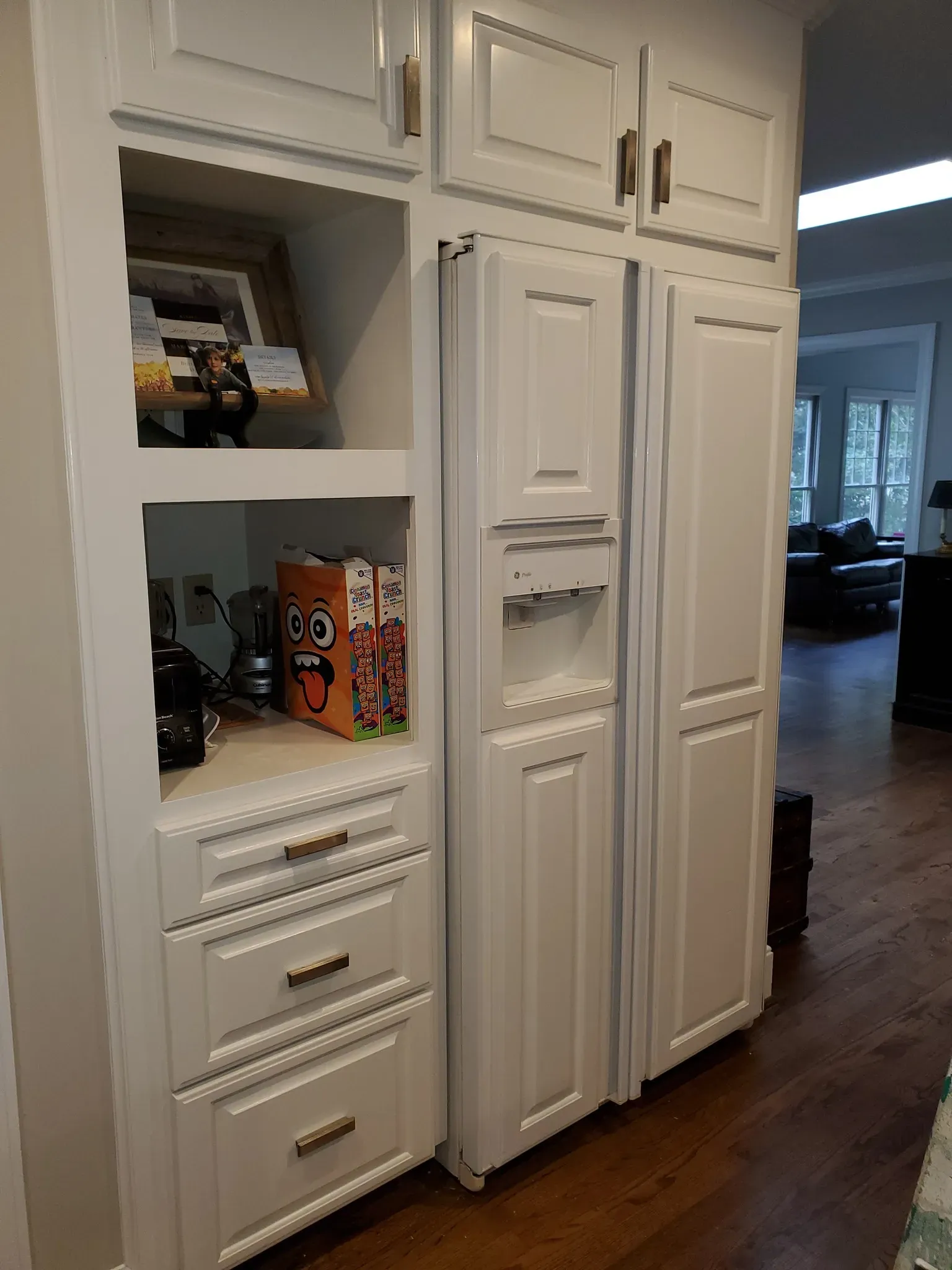 Kitchen cabinets repainted inside a South Carolina home.