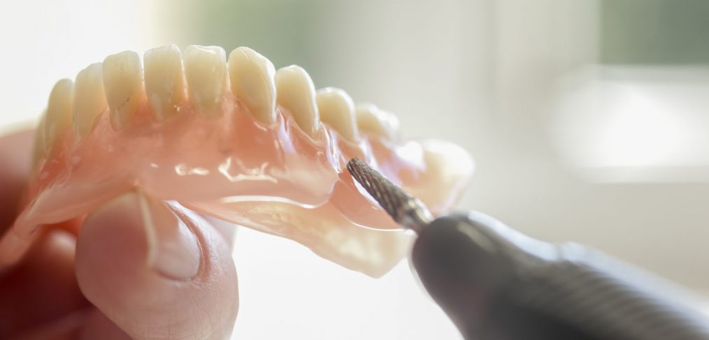 What is the process of getting dentures for the first time?