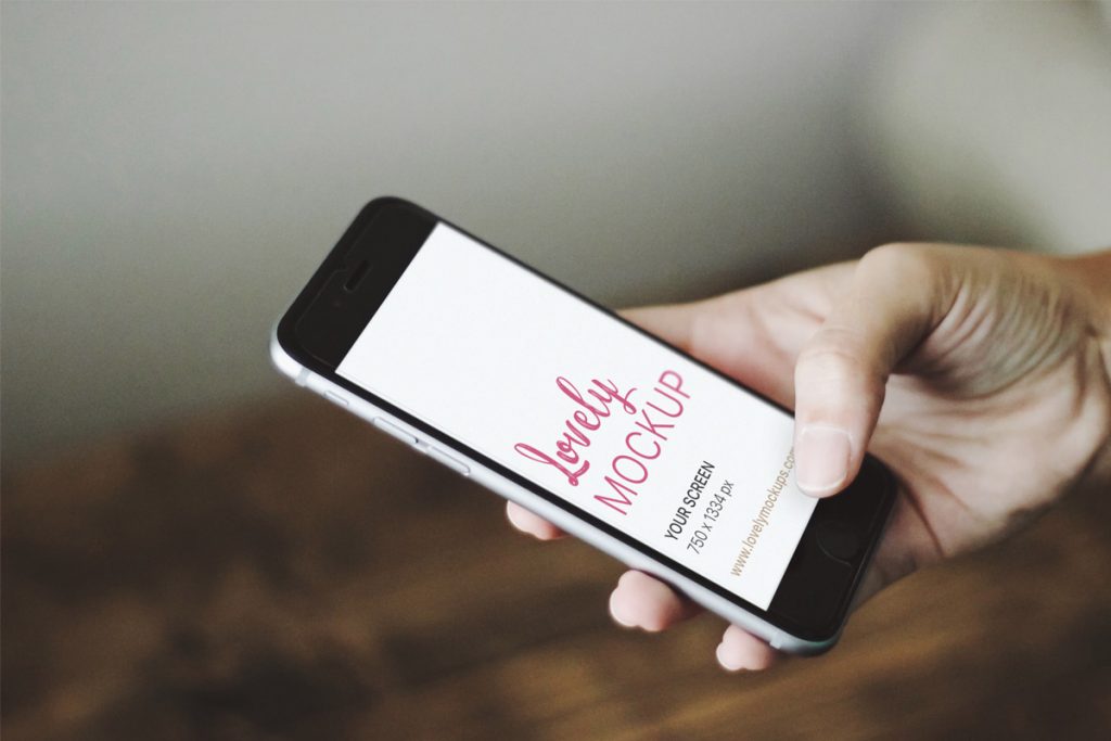Beautiful Woman Using iPhone X Mockup - Lovely Mockups