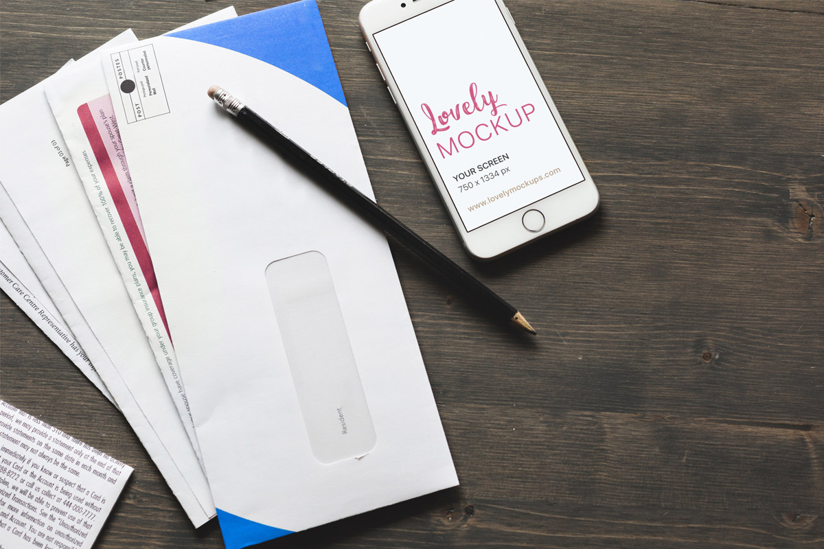 iPhone Mockup With Bills and Receipts on Table - Lovely Mockups