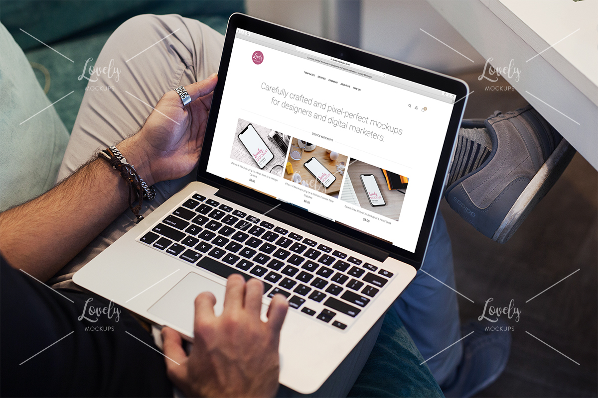 MacBook Mockup Featuring a Man Using His Laptop - Lovely Mockups