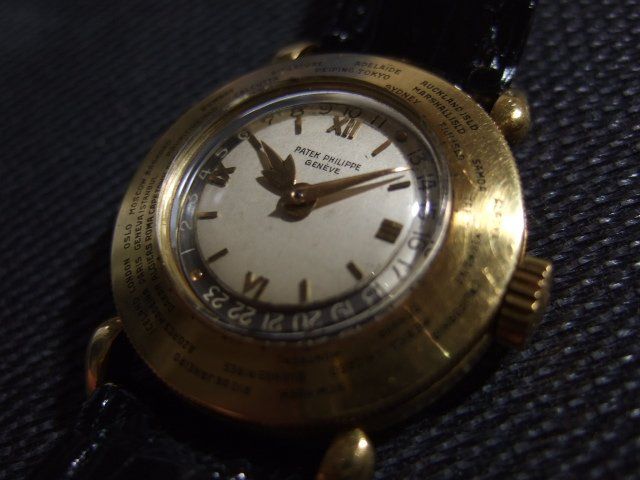 Patek Philippe - ref.1415 world time with tri-lobe hands