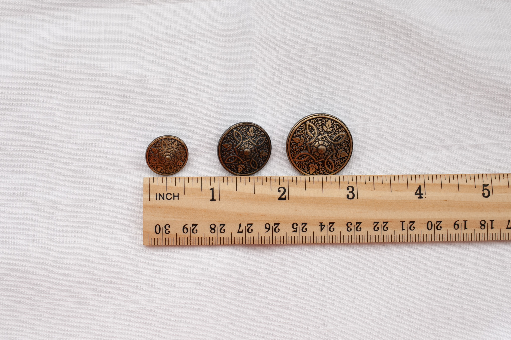 Antique Brass Shield Buttons - Stonemountain & Daughter Fabrics
