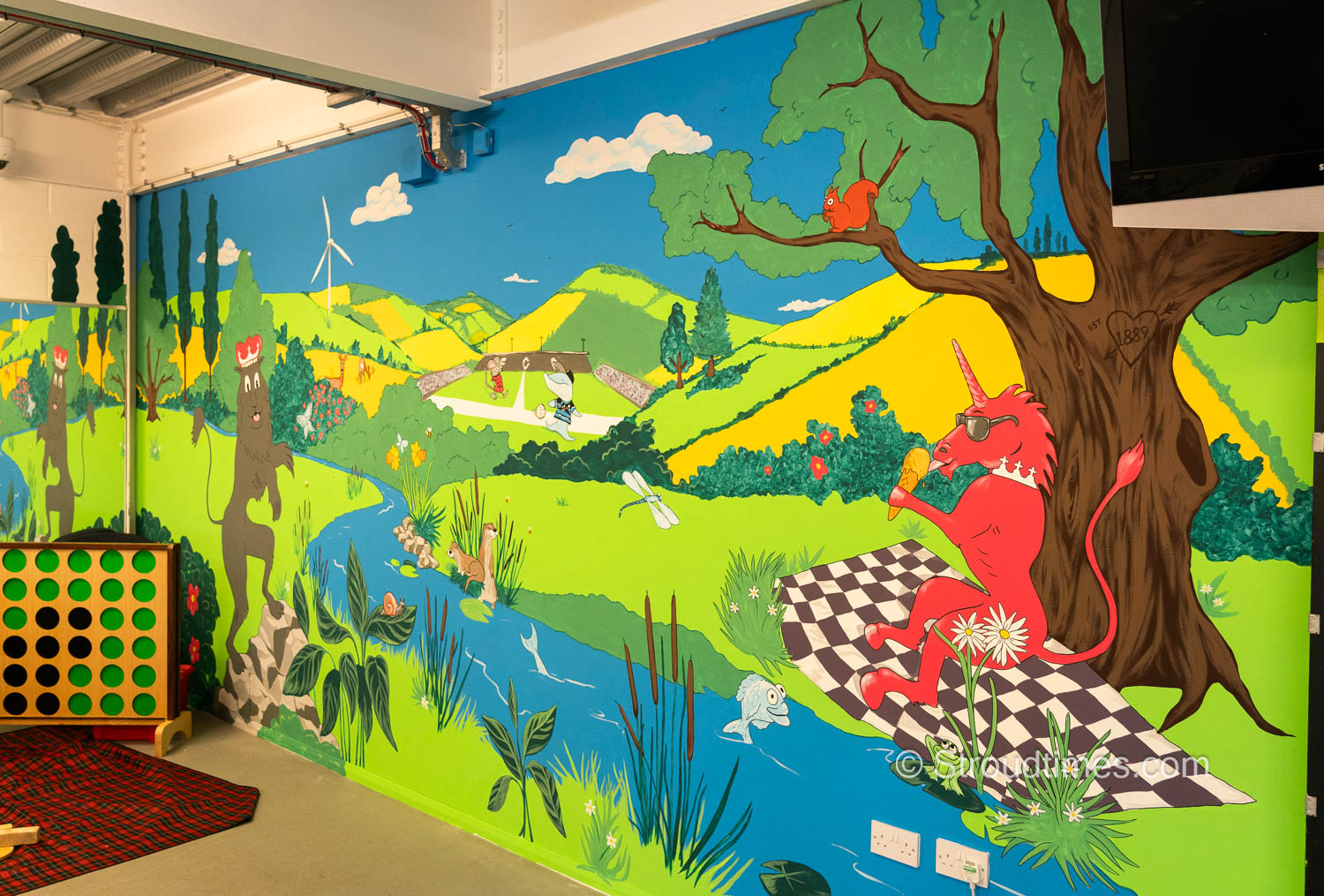 Back of the net! Kat completes mural ahead of new football season ...