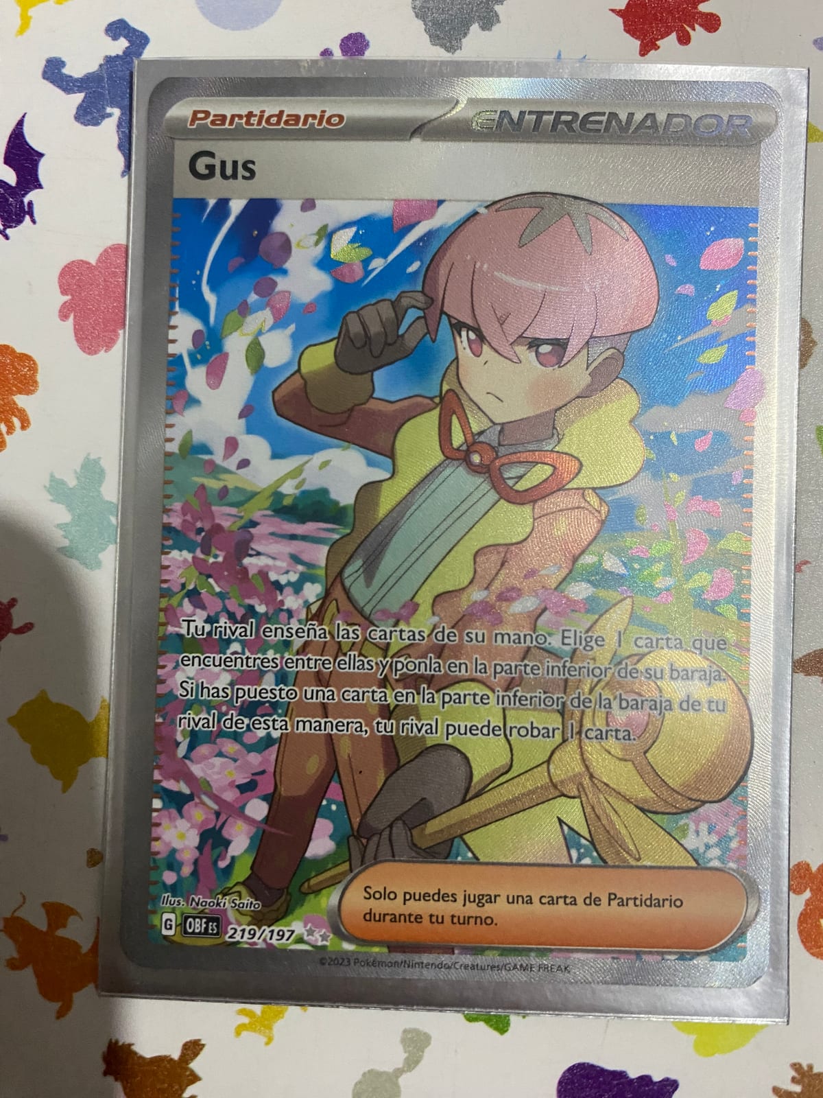 Gus, 219/197 , Español - TcgMatch Chile