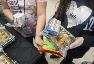 As lunch debt climbs, school districts grapple with balancing budgets ...