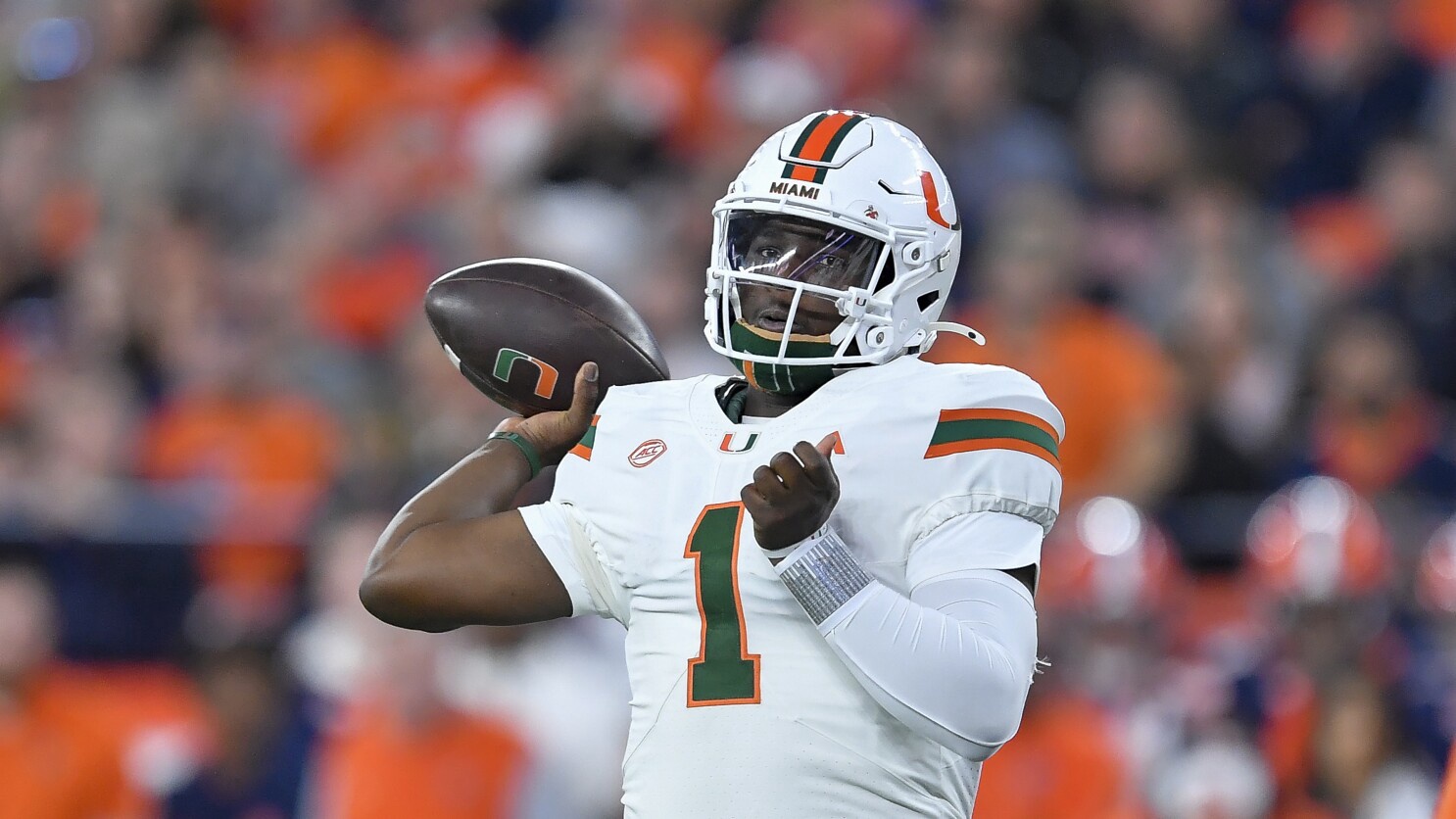 Particle News: Miami QB Cam Ward Wins Manning Award After Record ...