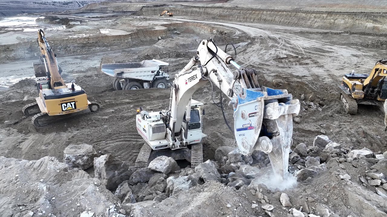 Terex RH30F And Caterpillar 385C Excavators Working On A Mining Area ...