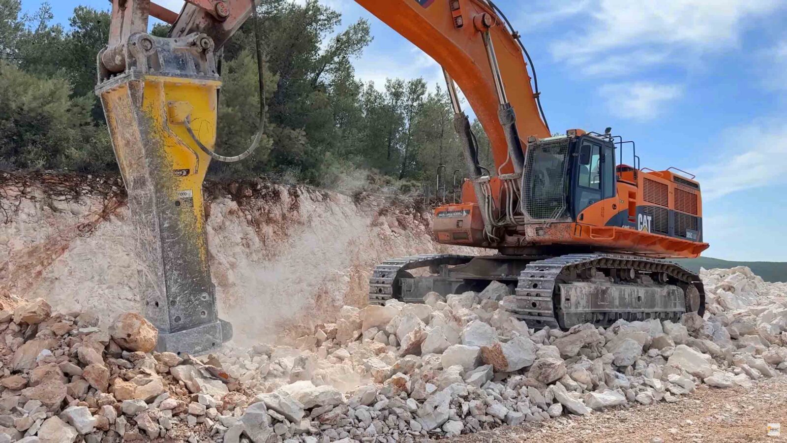 Excavator Breaking Hard Rock