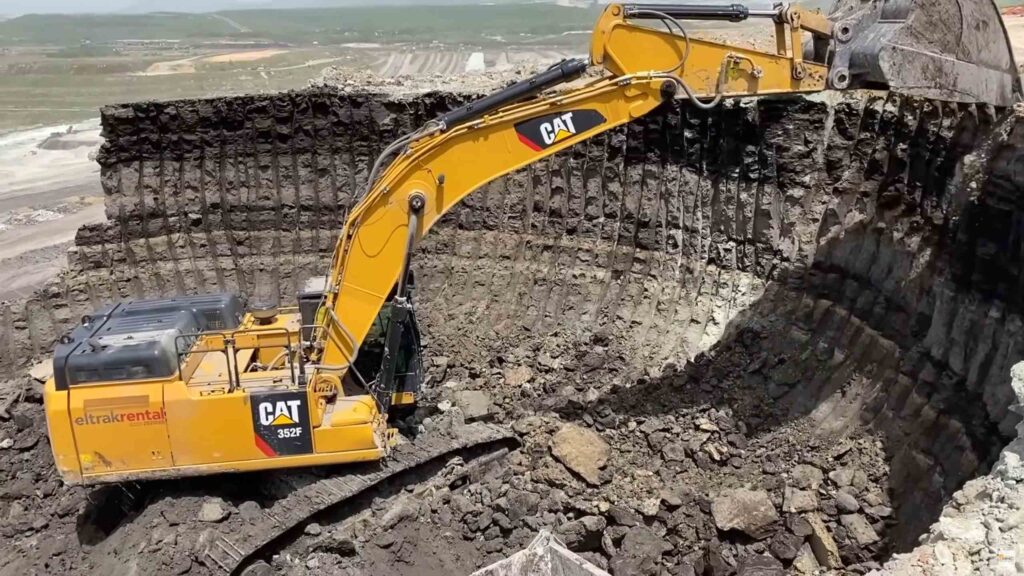 Excavator Breaking Hard Rock